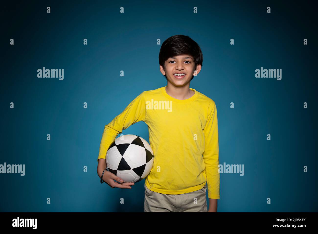 Happy positive boy holding hi-res stock photography and images - Alamy