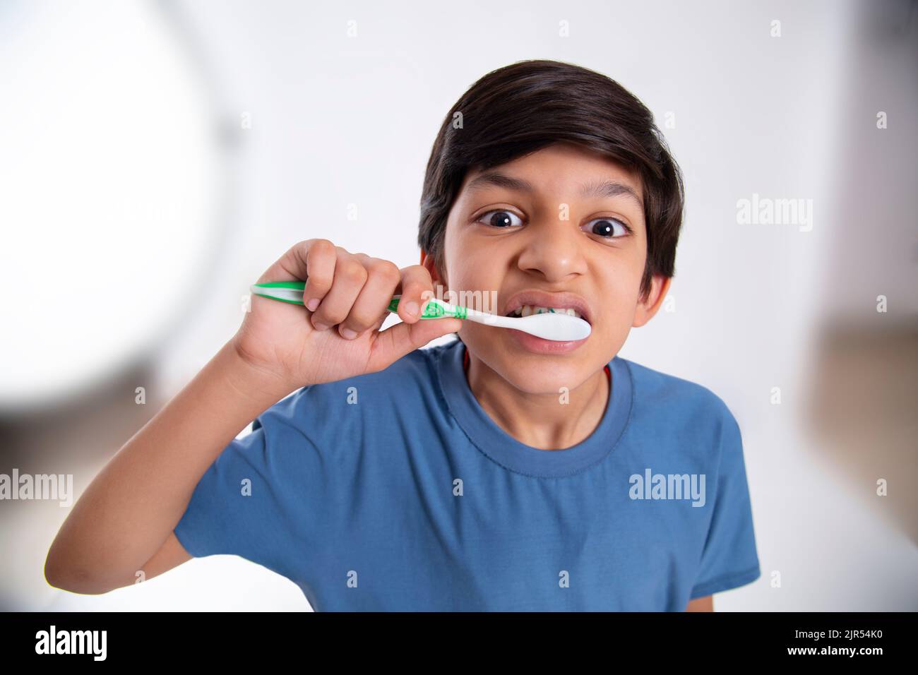 Close-up portrait of a boy brushing his teeth Stock Photo - Alamy
