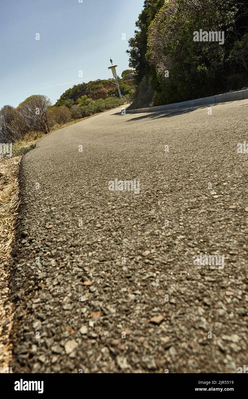 Detail of a small asphalt road flowing in the middle of Sardinia Stock ...