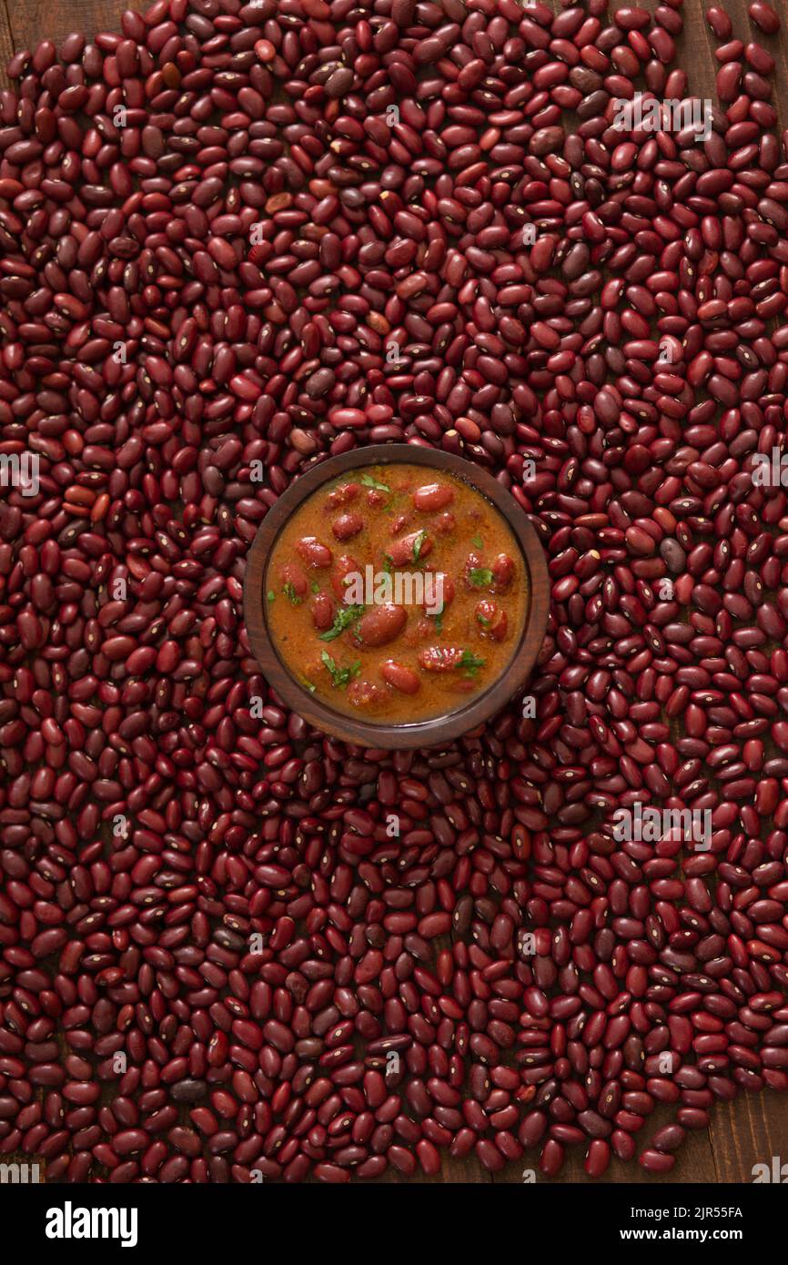 A SMALL BOWL OF RAJMA CURRY KEPT ON TABLE FILLED WITH RAW KIDNEY BEANS ...