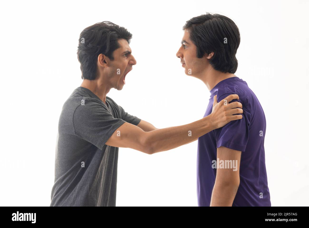 Portrait of two teenage boys fighting against pain background Stock ...