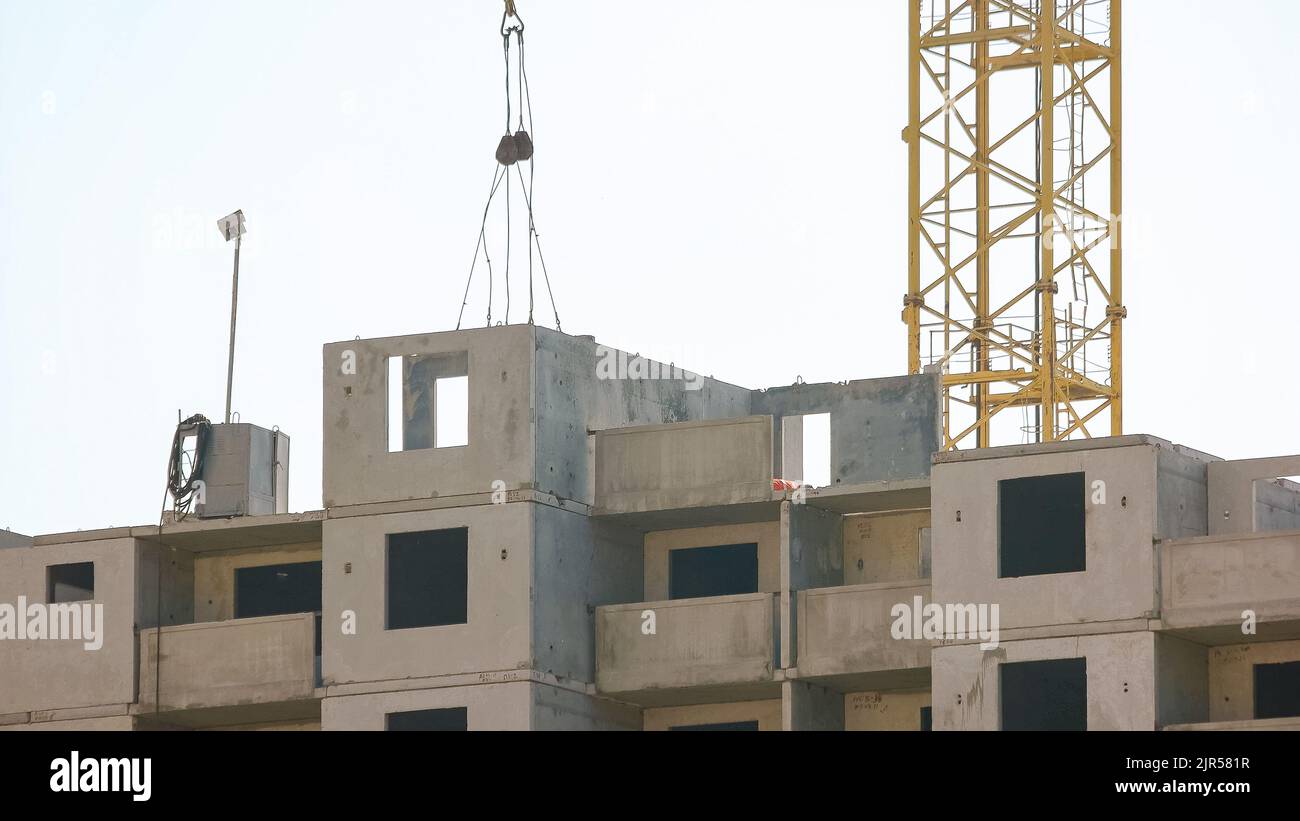 Motion of a crane transporting block on the building. Process of ...