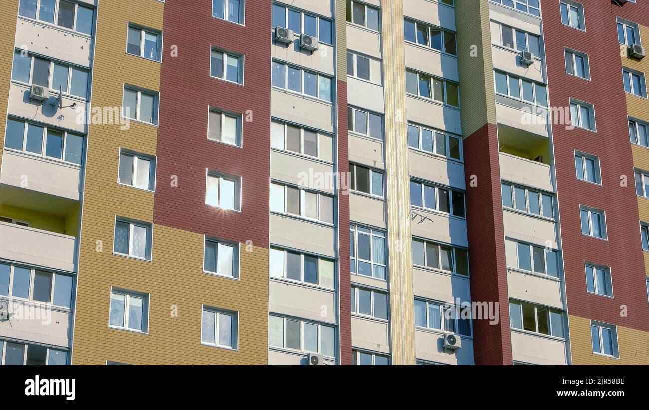 Multicolored high-rise apartment house for background. Ugly buildong in ...