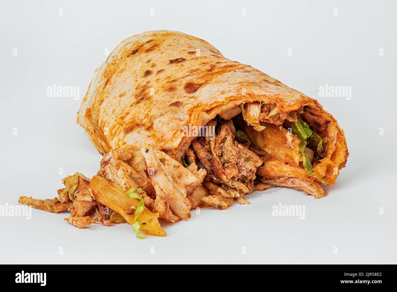 Isolated on a white background, spoiled and greasy and unhealthy doner ...