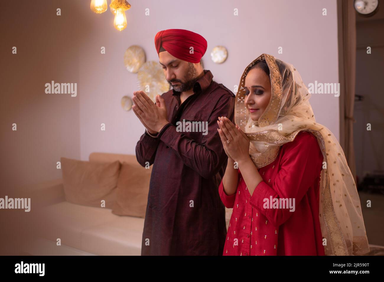 Portrait of Sikh couple praying Stock Photo - Alamy