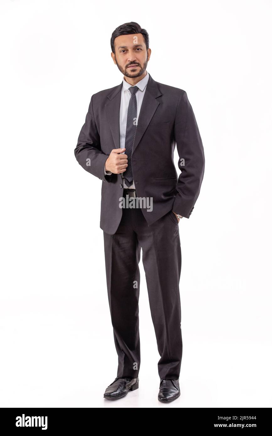 Portrait of a corporate employee in formal business suit standing with ...