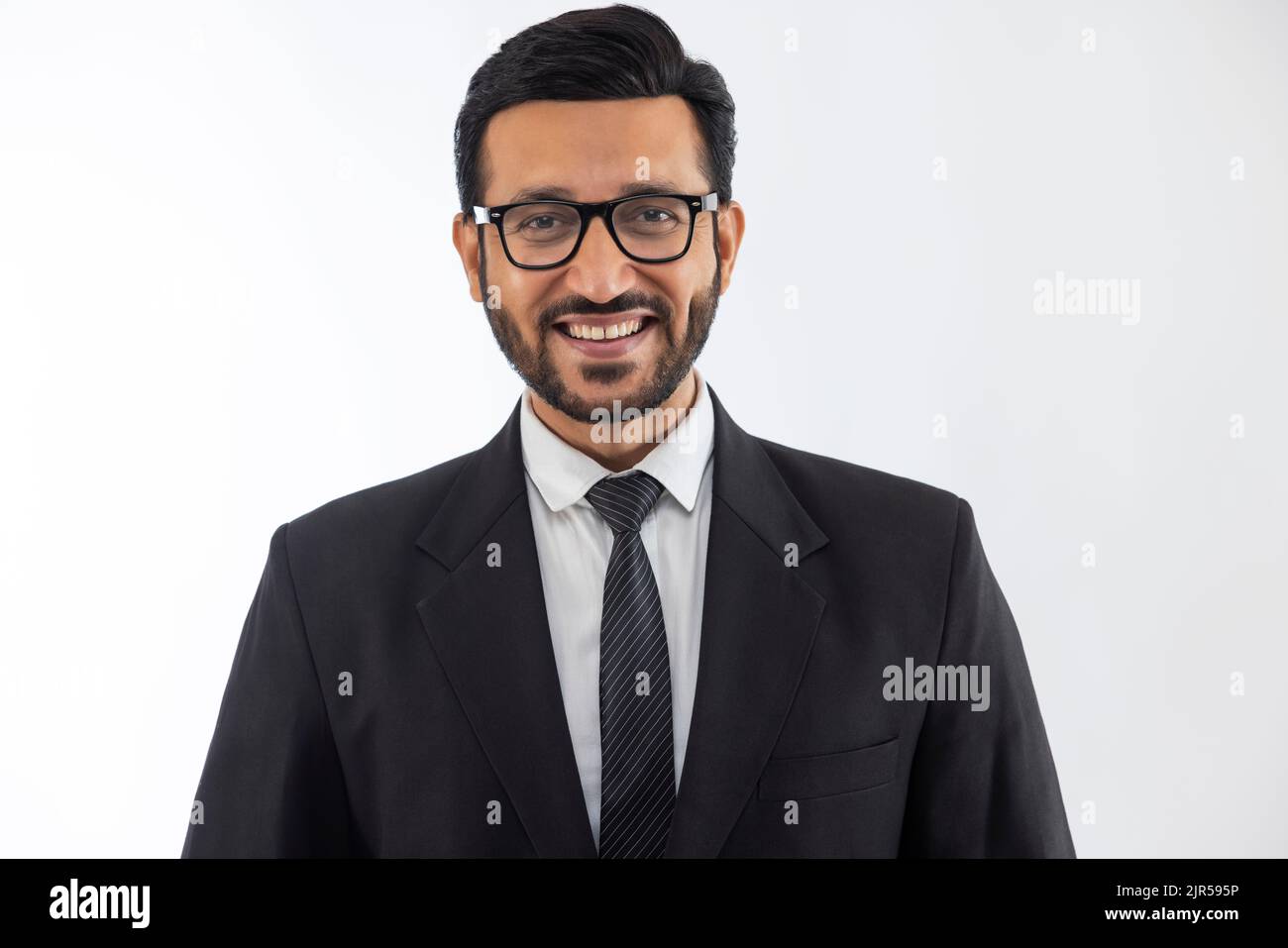 Portrait of a corporate employee in formal business suit smiling ...