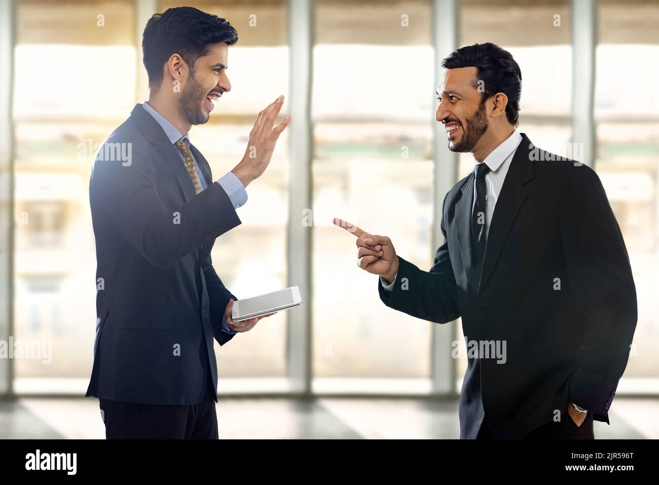 Corporate Employees In Formal Business Suit Talking And Laughing With