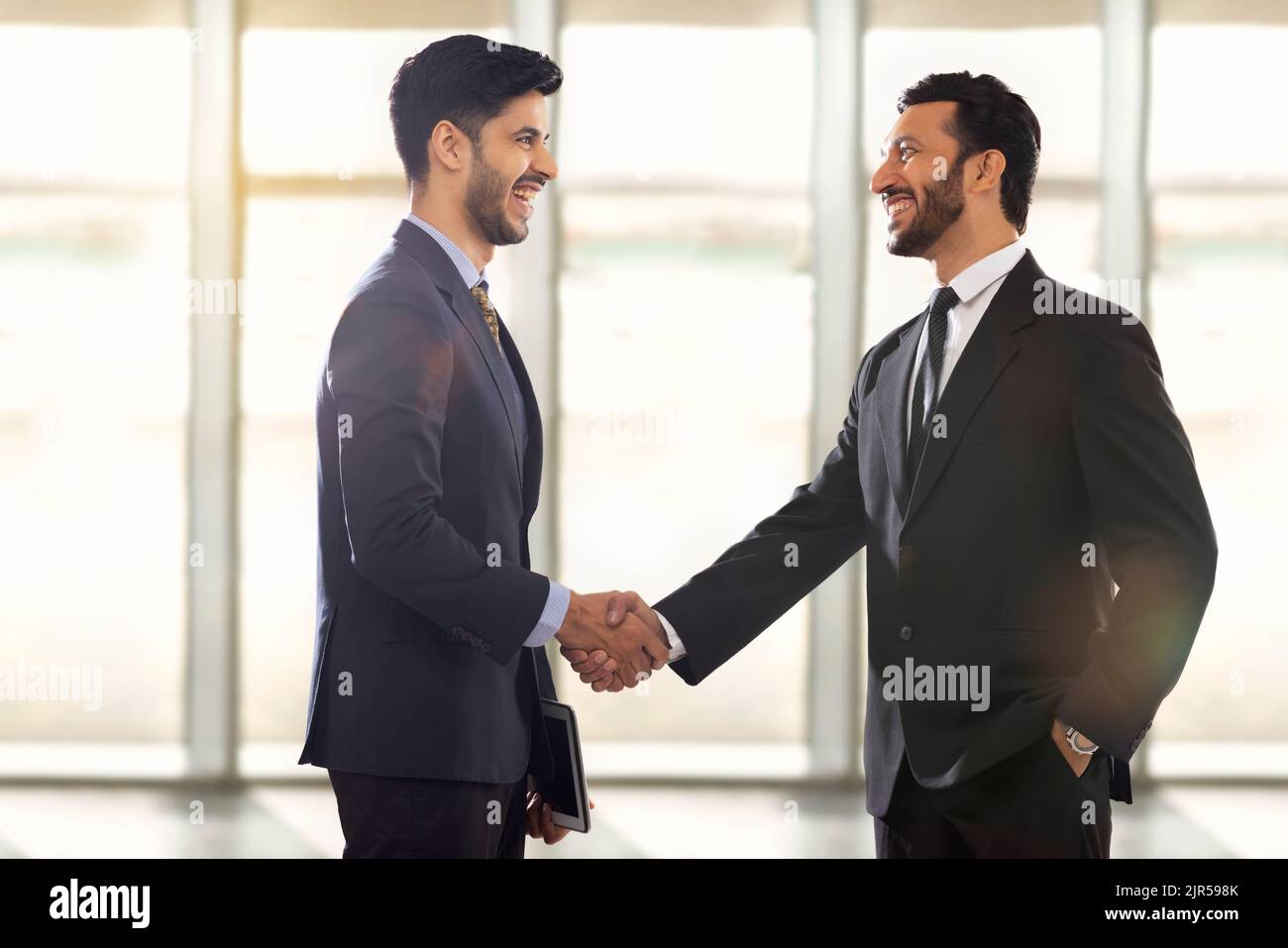 Corporate employees in formal business standing together in office ...