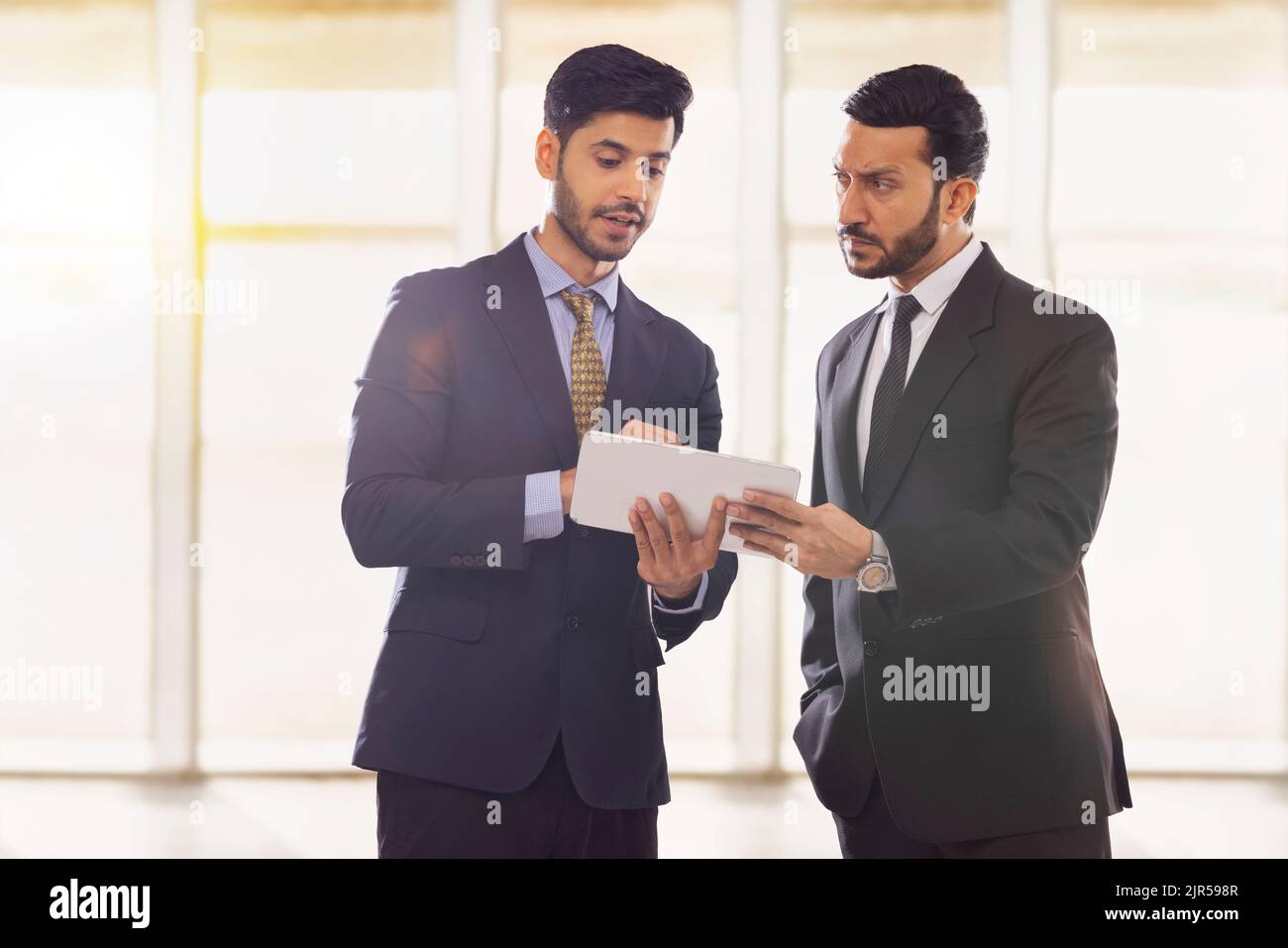 Corporate employees in formal business suit working together on a ...