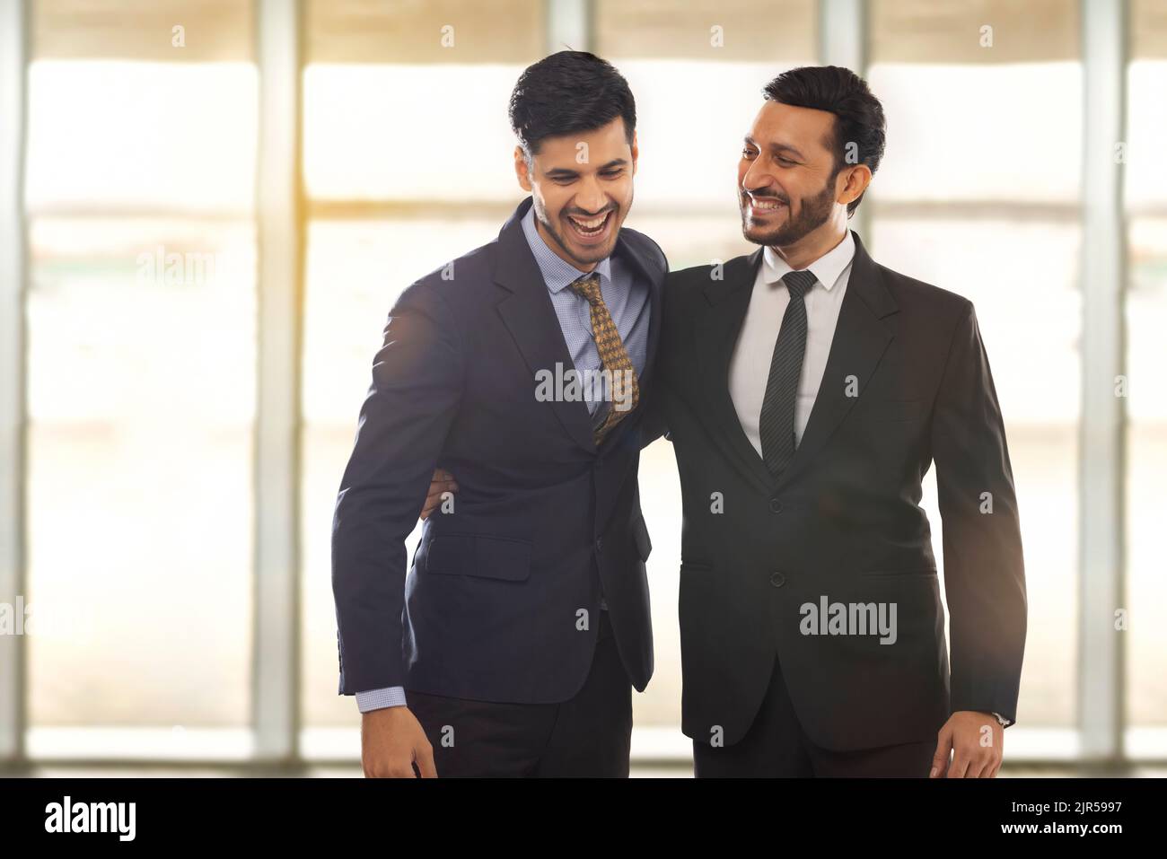 Corporate employees in formal business suit side hugging each other ...