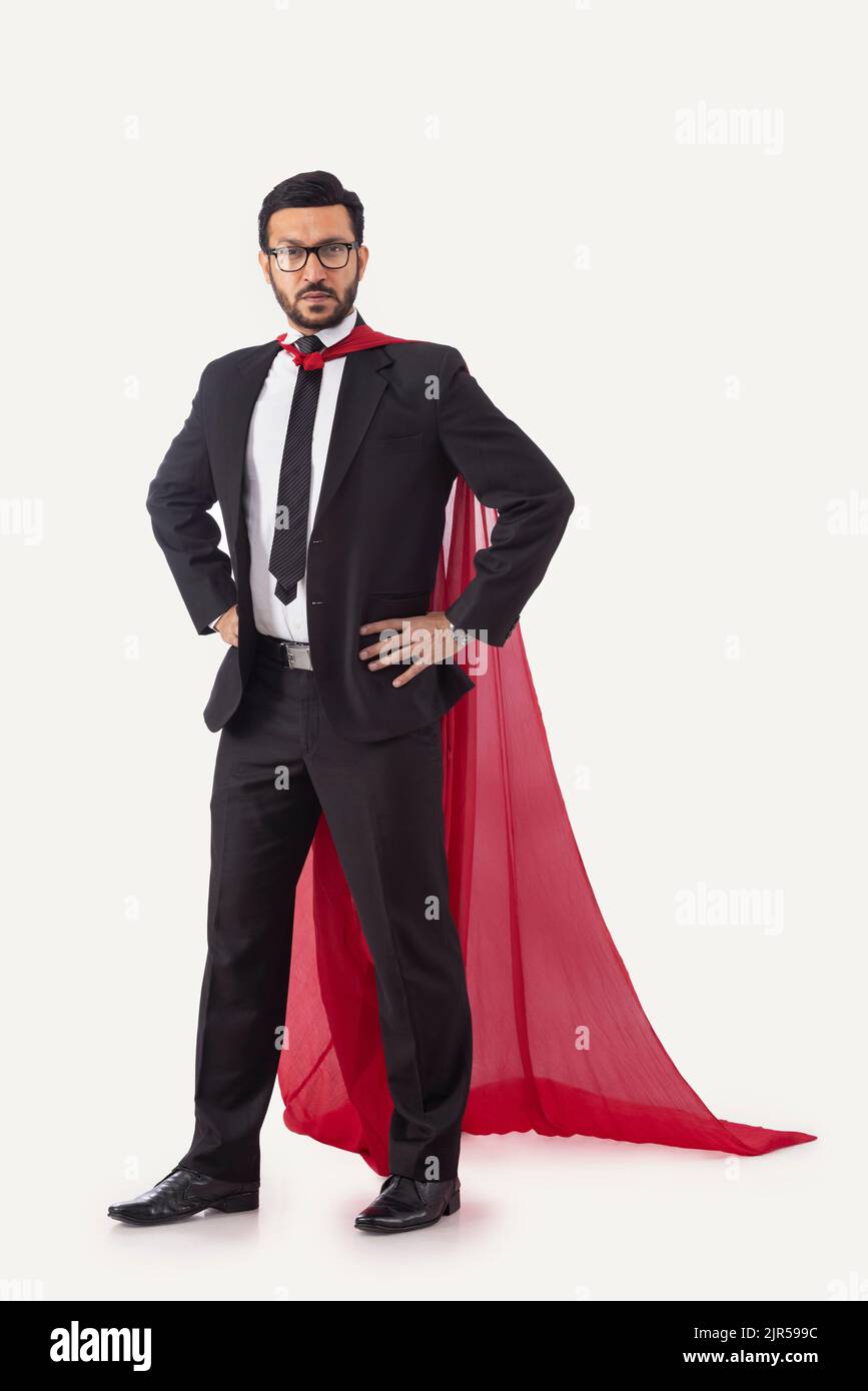 A corporate employee in formal business suit standing, wearing a red ...