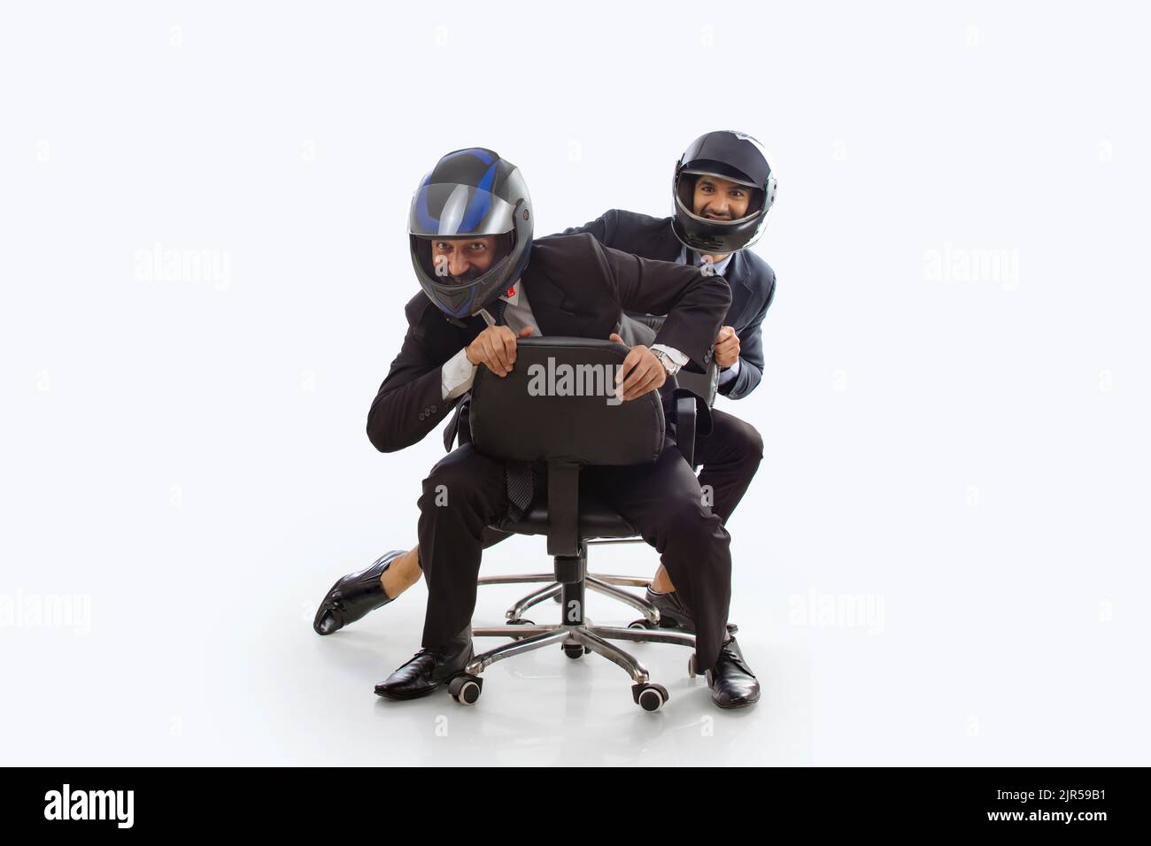Corporate employees in formal business suit enjoying by wearing helmets ...
