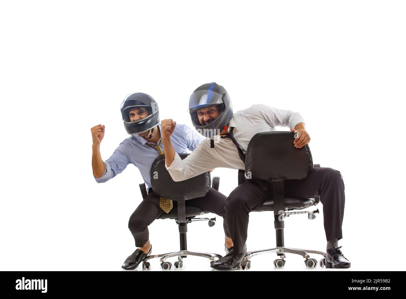 Corporate employees in formal clothing enjoying by wearing helmets ...