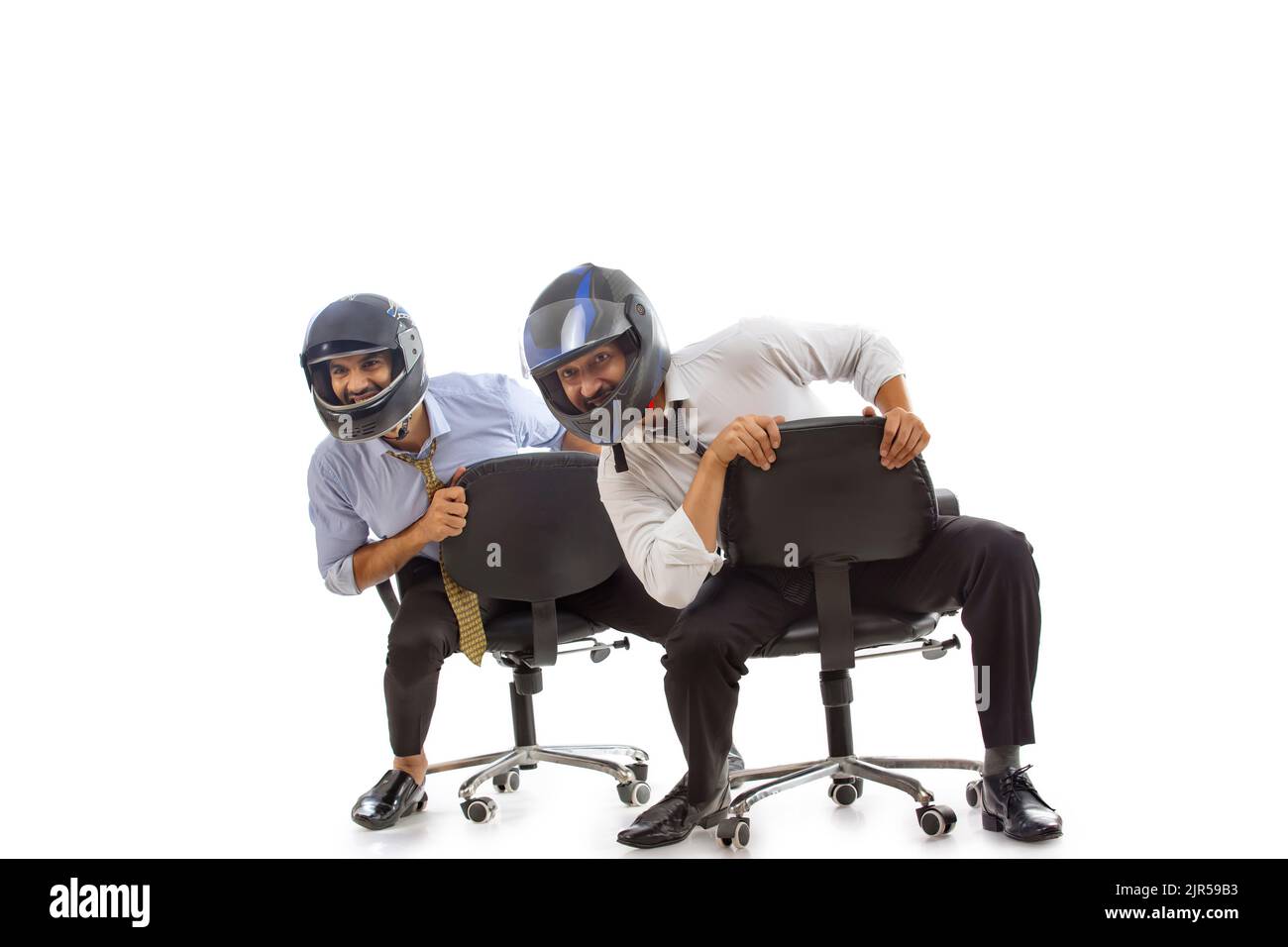 Corporate employees in formal clothing enjoying by wearing helmets and ...