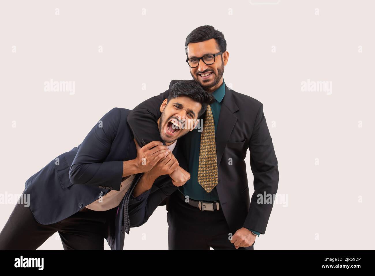 Corporate employees in formal business suit having fun with one ...