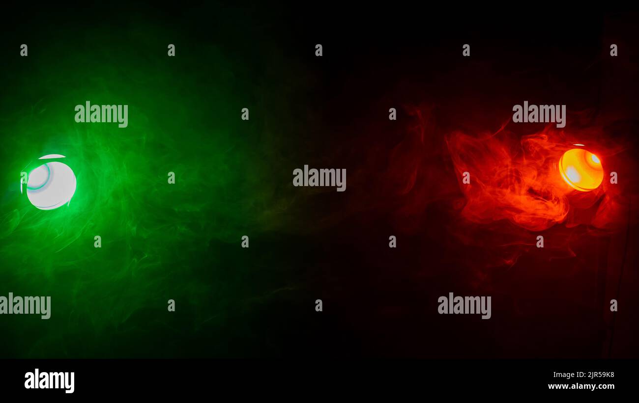 Red green smoke on a black background Stock Photo - Alamy