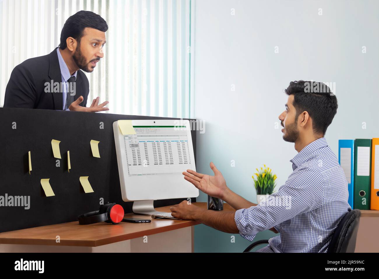 An angry boss in formal suit and a subordinate corporate employee ...