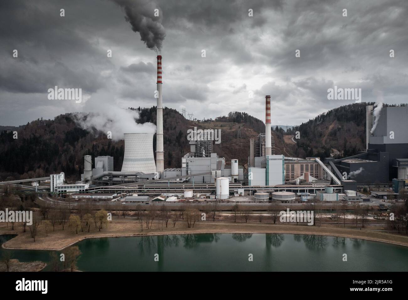 Industrial area, a coal fired power plant with chimneys and cooling ...