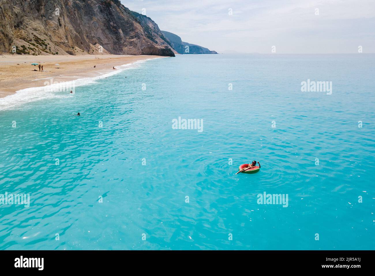 aerial view of greece beach woman floating on inflatable ring Stock ...