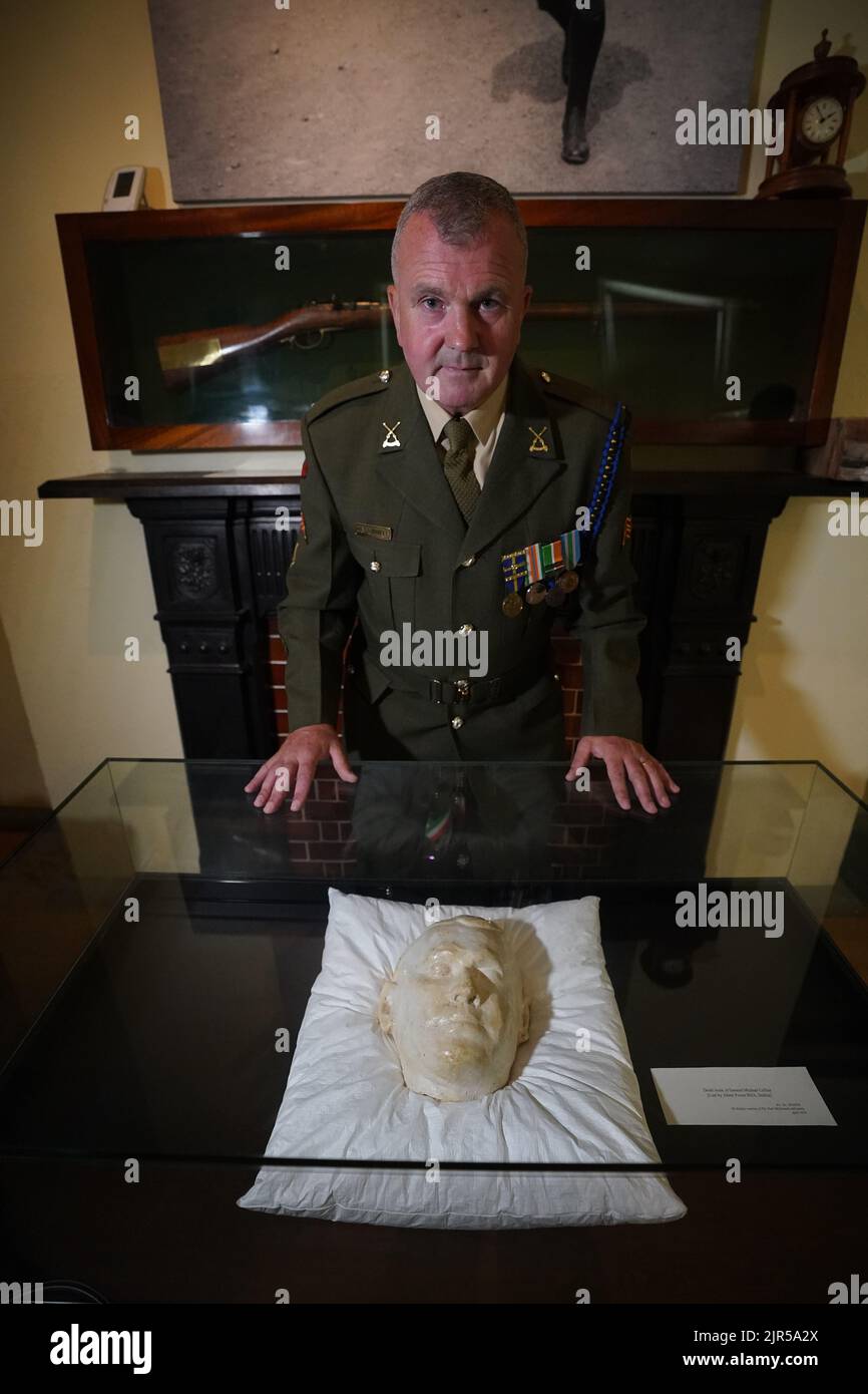 Corporal Noel McDonnell, pictured with the death mask of Michael Collins during services to ...