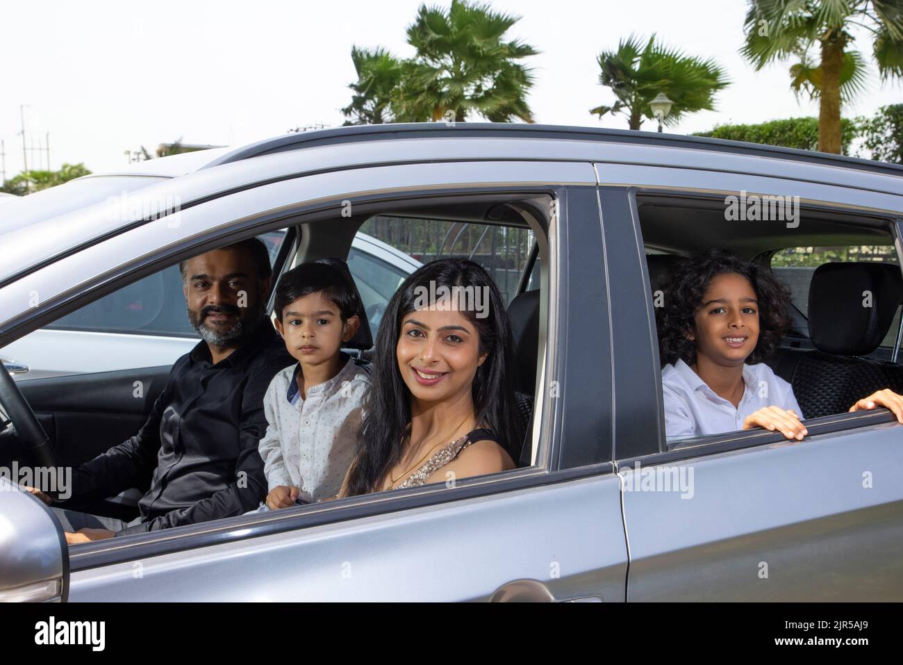 Portrait of happy Indian family inside a car Stock Photo - Alamy