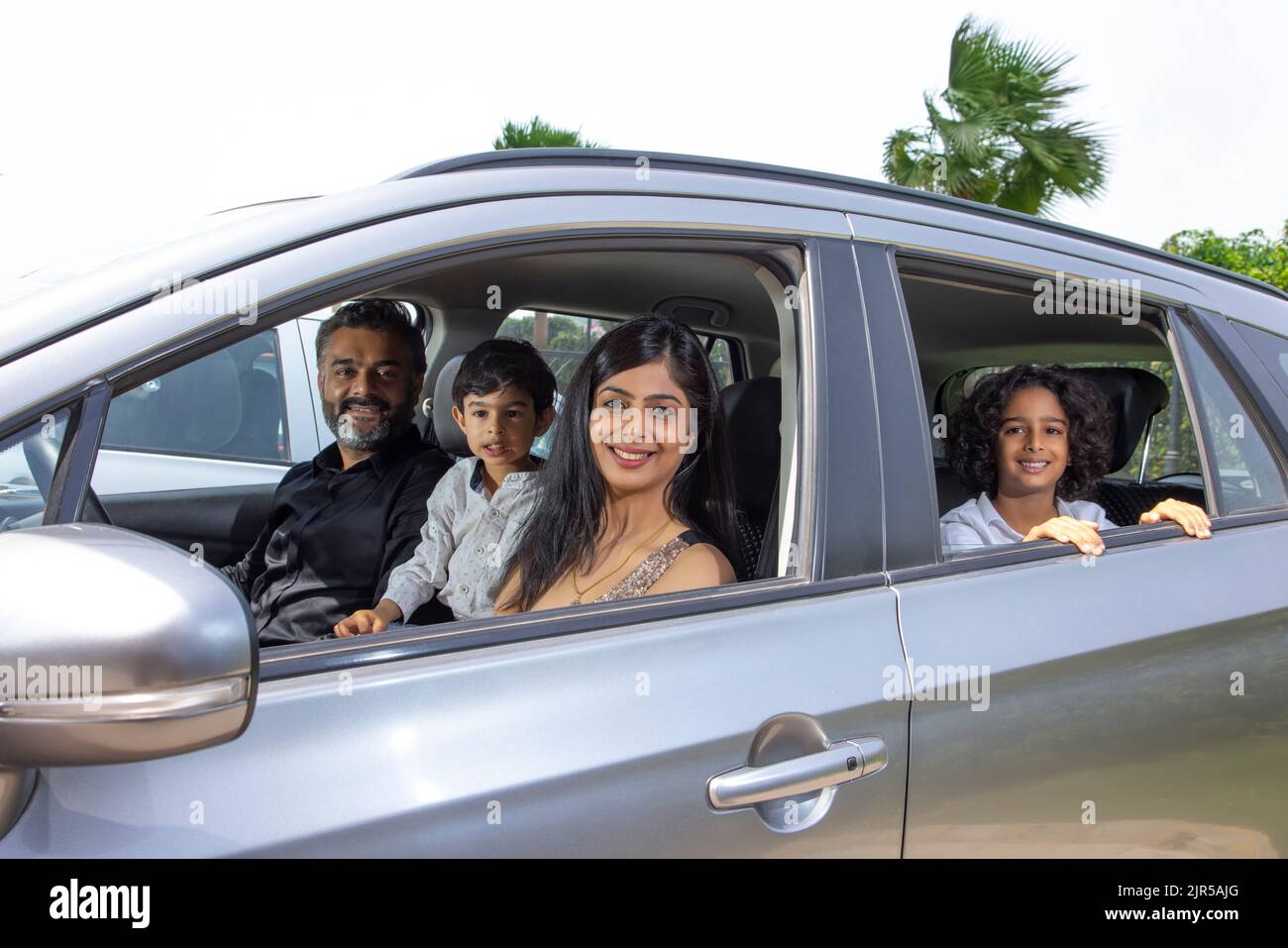 Portrait of happy Indian family inside a car Stock Photo - Alamy