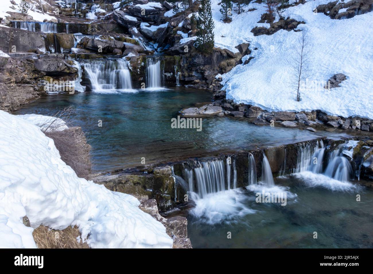 waterfall in ordesa national park in the spanish pyrenees in winter ...