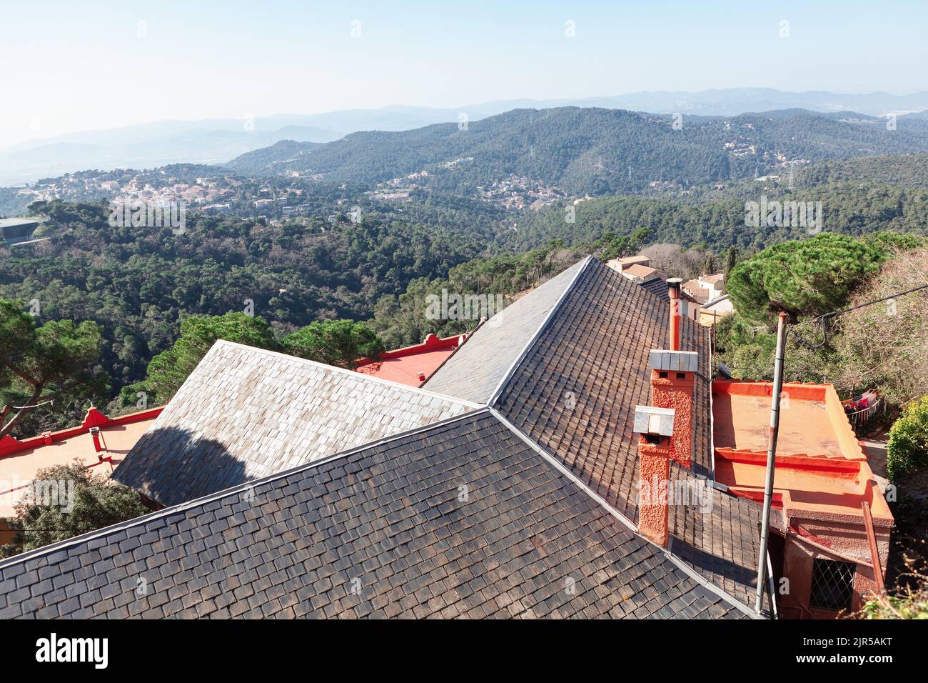 Residential house in mountains view from above . Aerial view of tiled ...