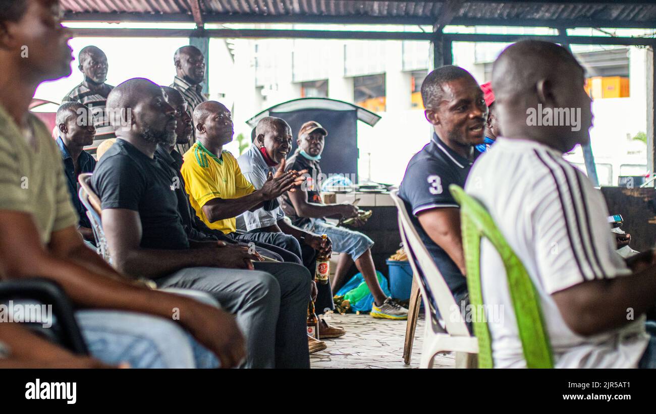Nigerian fans watch a match in a makeshift restaurant run by a Nigerian ...