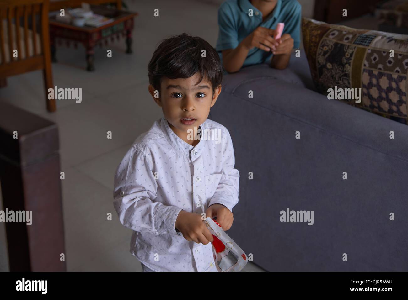 Portrait of a little child looking at camera Stock Photo - Alamy