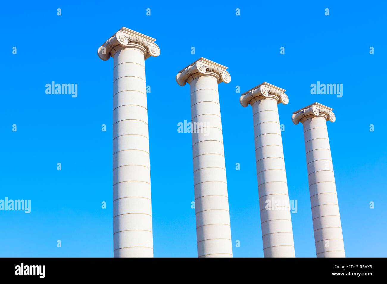 Greek Ionic Columns Against Blue Sky . Ancient architecture style Stock ...