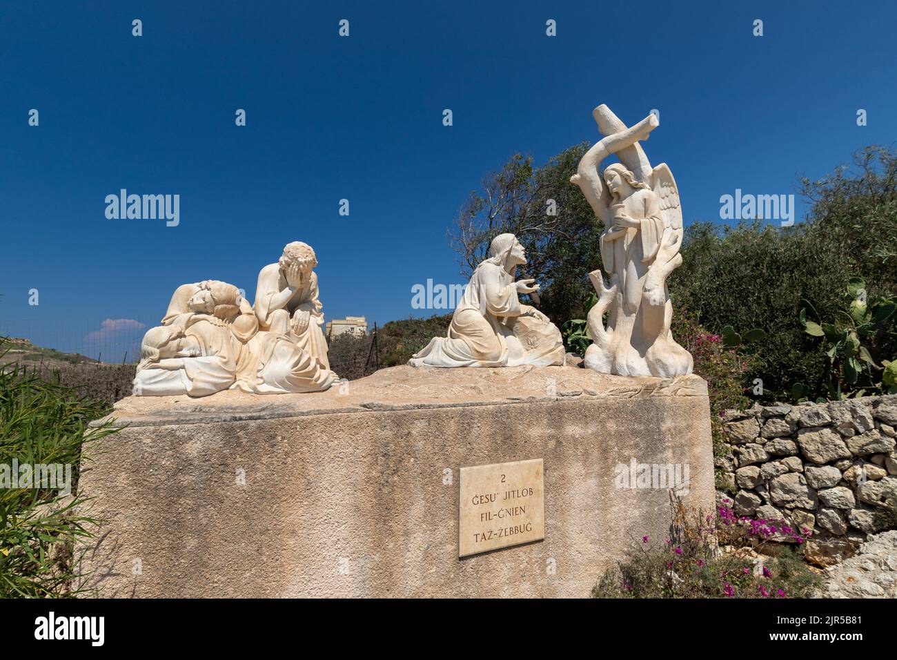 one of the 14 marble statues representing the Via Crucis or Way of the ...