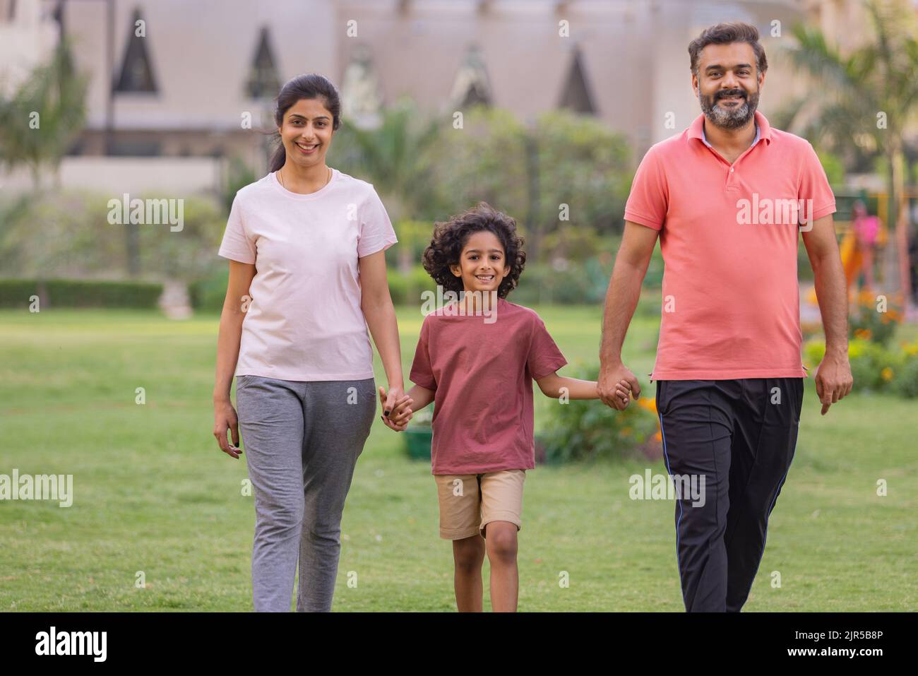 Indian family walking in hi-res stock photography and images - Alamy