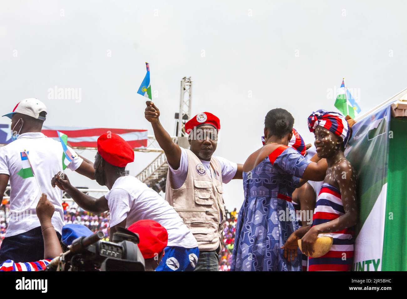 Young Liberians marching while waving flags during the celebration of ...