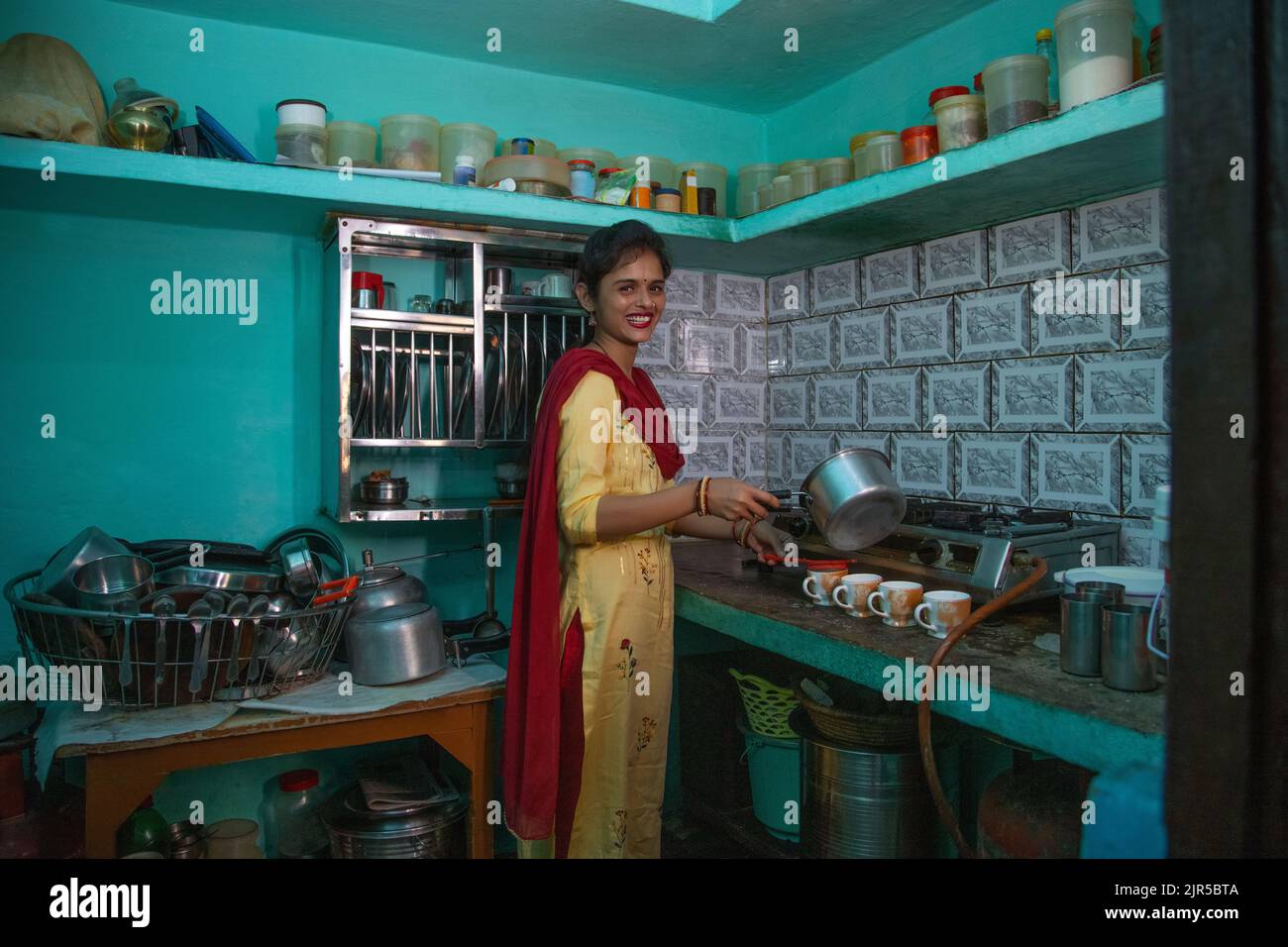 Portrait of a housewife making tea in the kitchen Stock Photo - Alamy