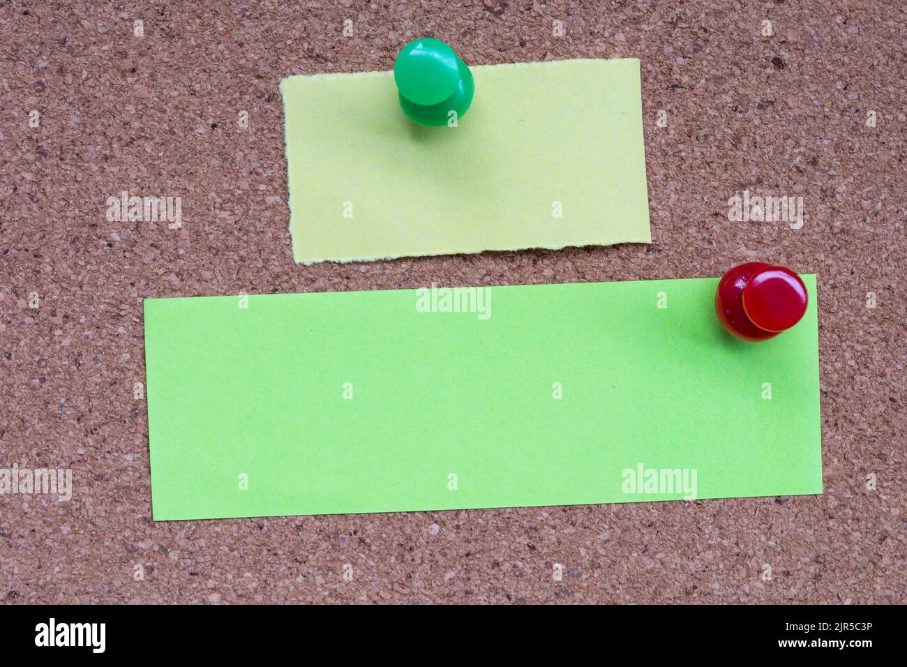 Stick note and pinned to a cork notice board. Copy space. Reminder ...