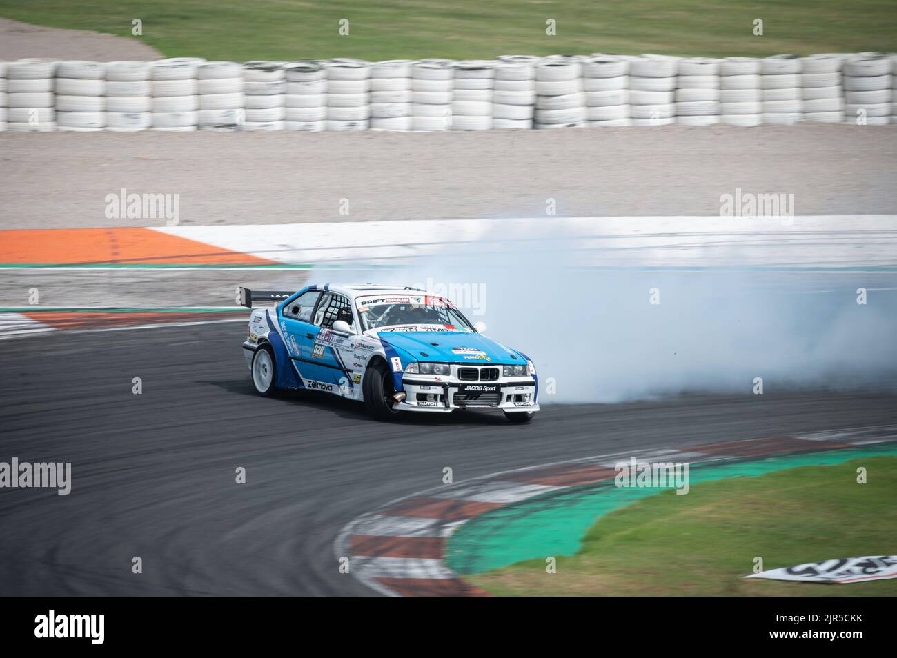 A white and blue BMW E36 drifting during a race Stock Photo - Alamy