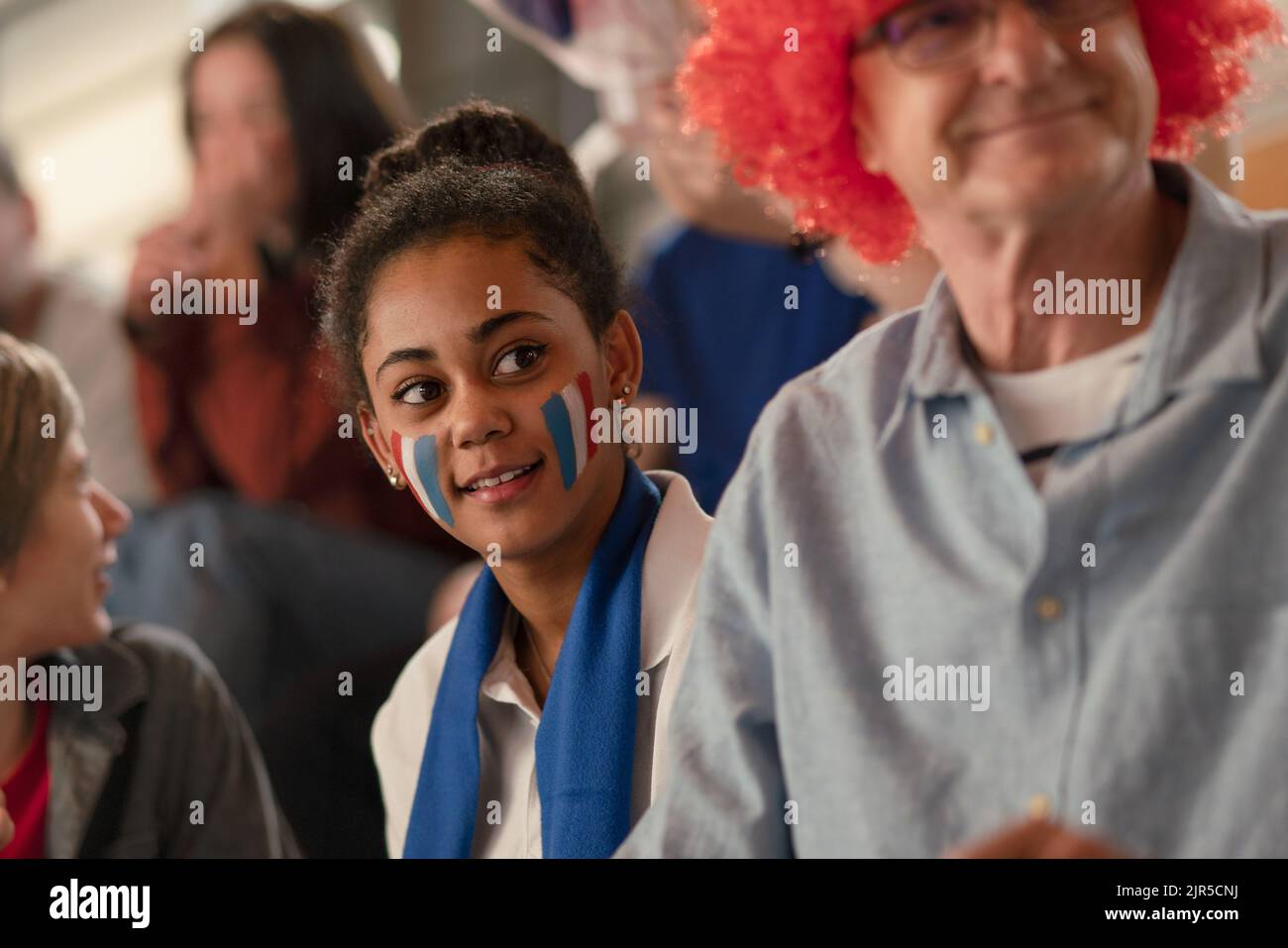 Excited football fans supproting French national team in live soccer ...