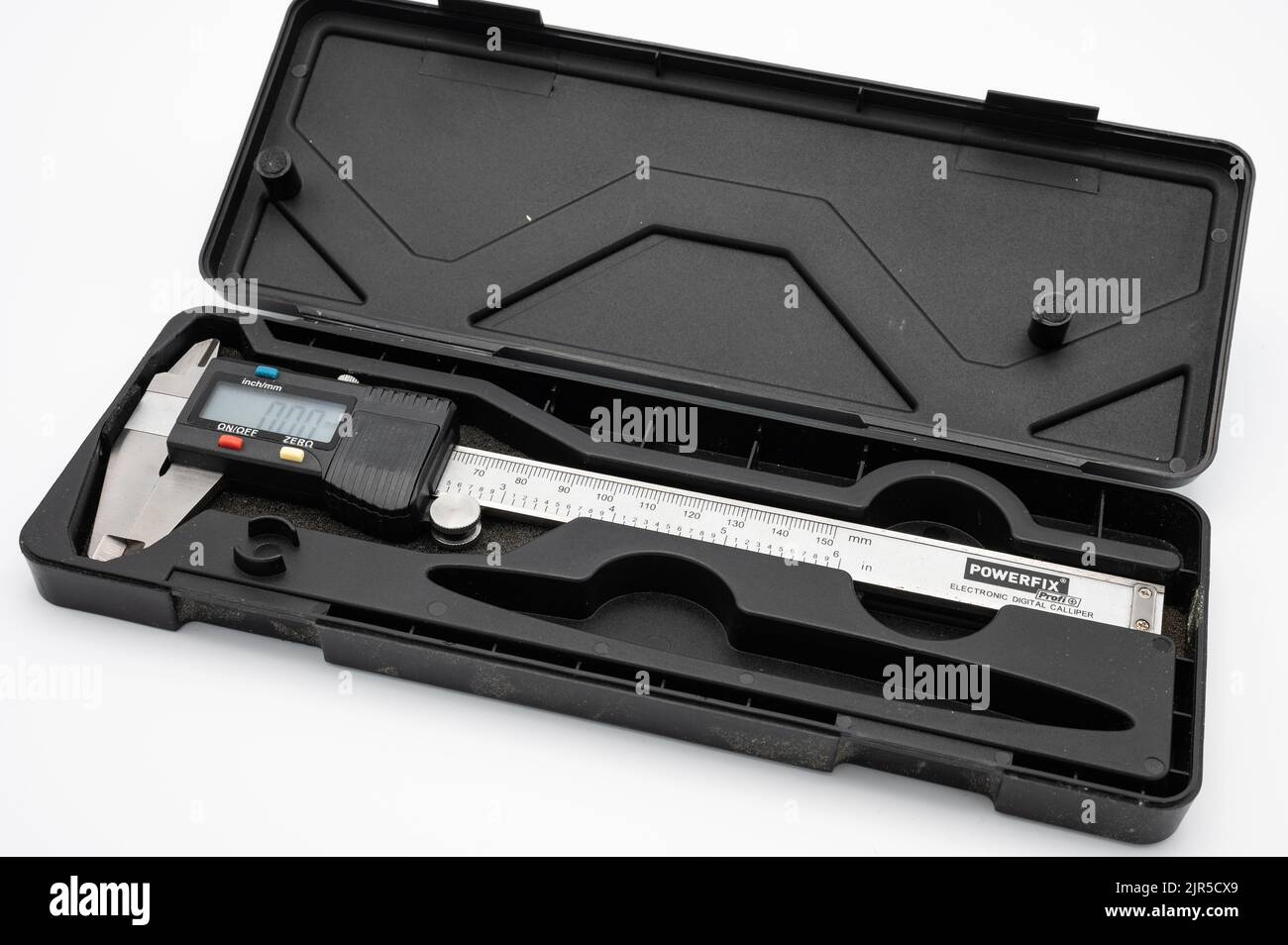 A precision measuring tool in the box, isolated on a white background ...