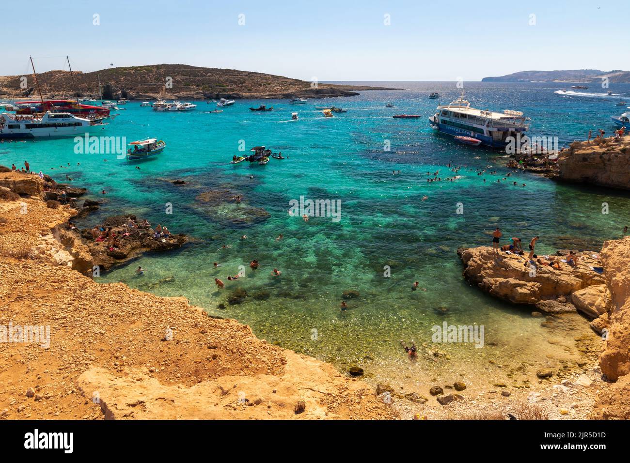 Blue Lagoon is a popular small bay for a day trip with shallow, azure ...