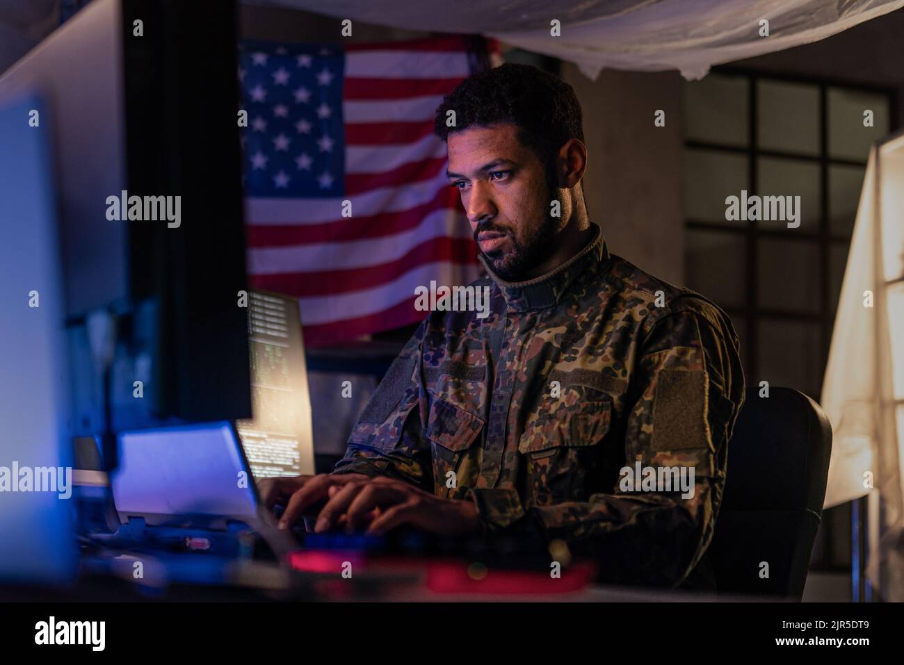 American hacker in military unifrorm on dark web, cyberwar concept ...