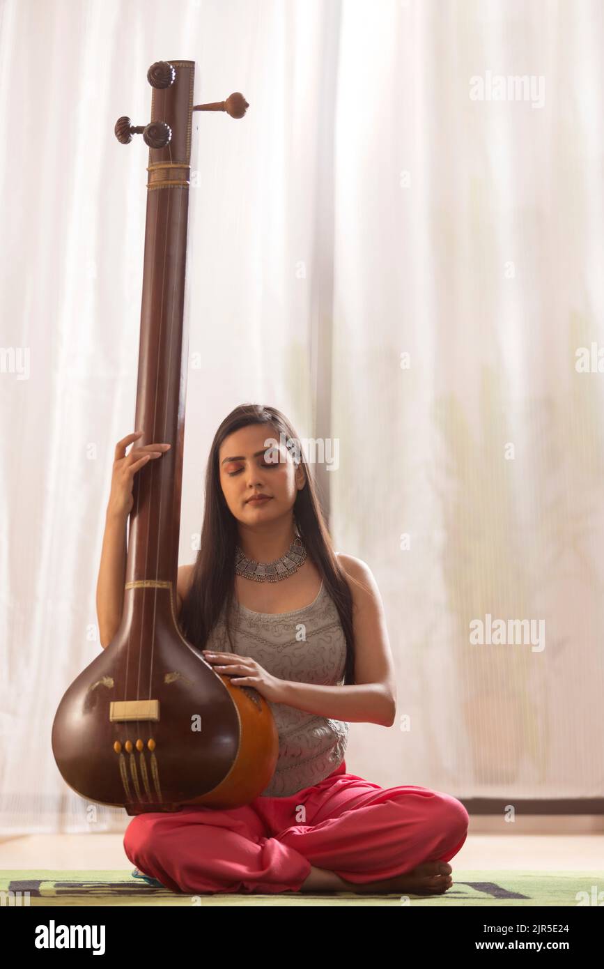 Portrait indian classical musician playing hi-res stock photography and ...