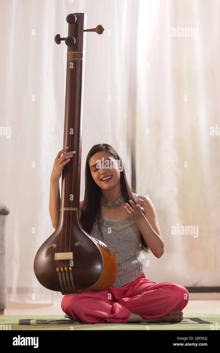 Portrait indian classical musician playing hi-res stock photography and ...