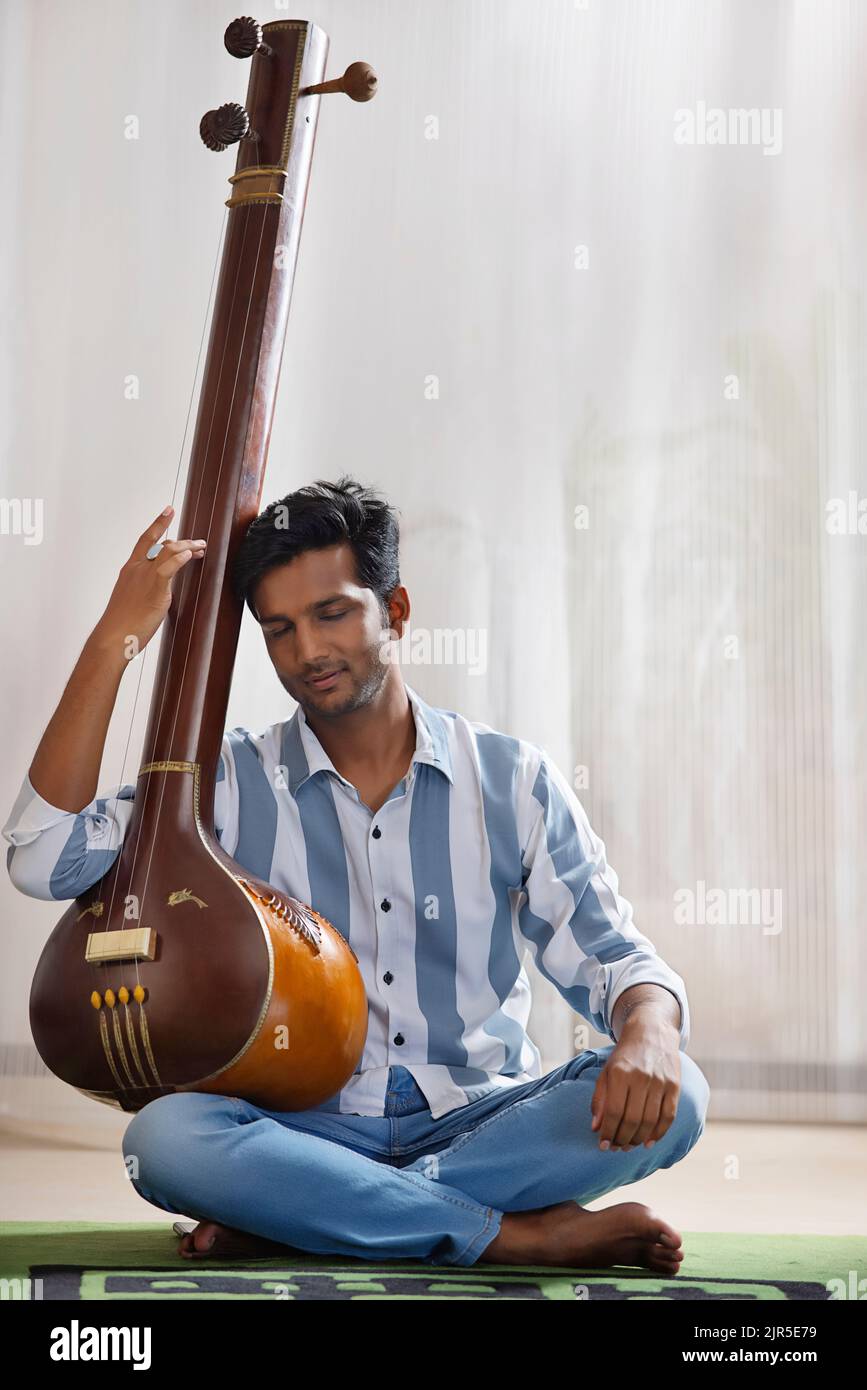 Portrait indian classical musician playing hi-res stock photography and ...