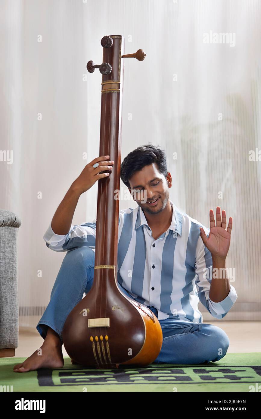 Portrait indian classical musician playing hi-res stock photography and ...