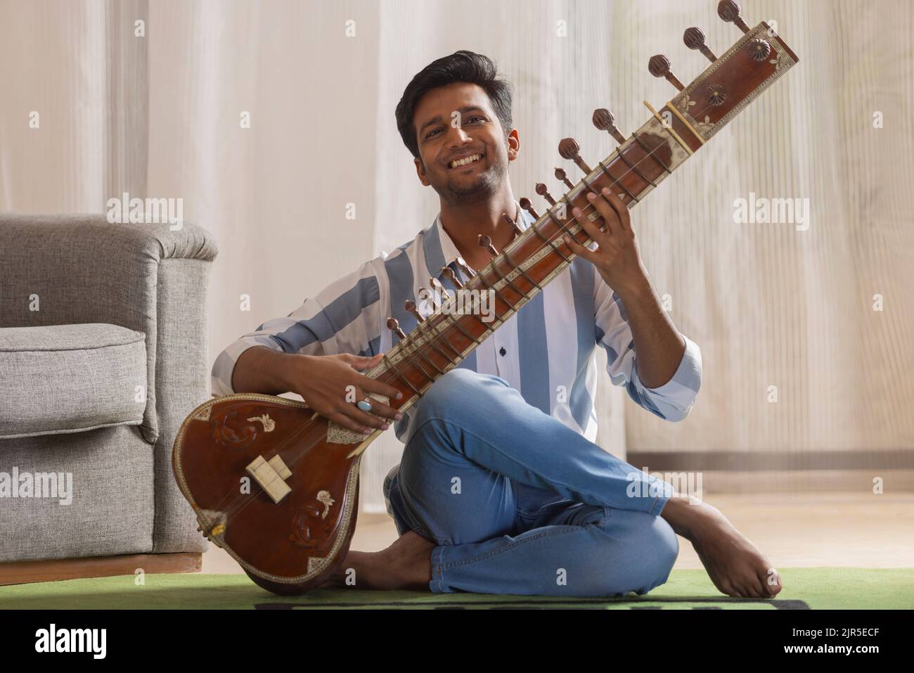 Portrait indian classical musician playing hi-res stock photography and ...