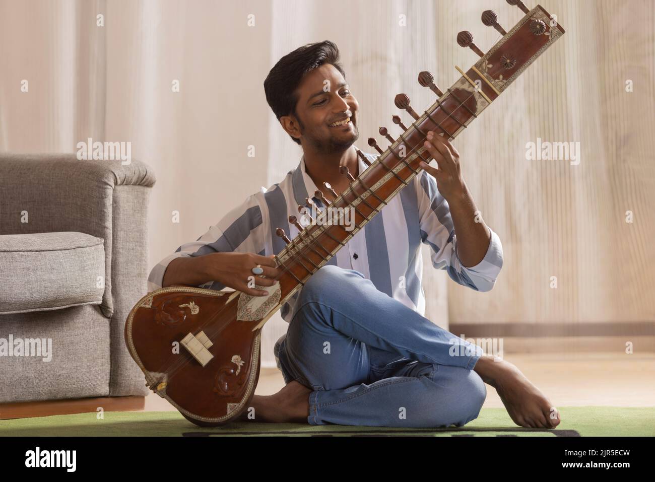 Portrait indian classical musician playing hi-res stock photography and ...