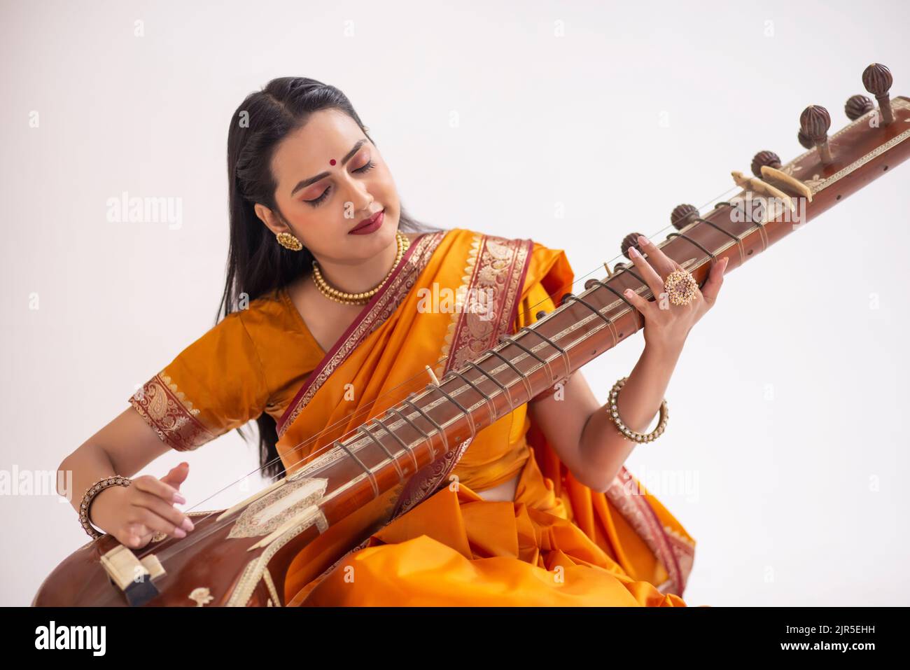 Playing sitar hi-res stock photography and images - Alamy