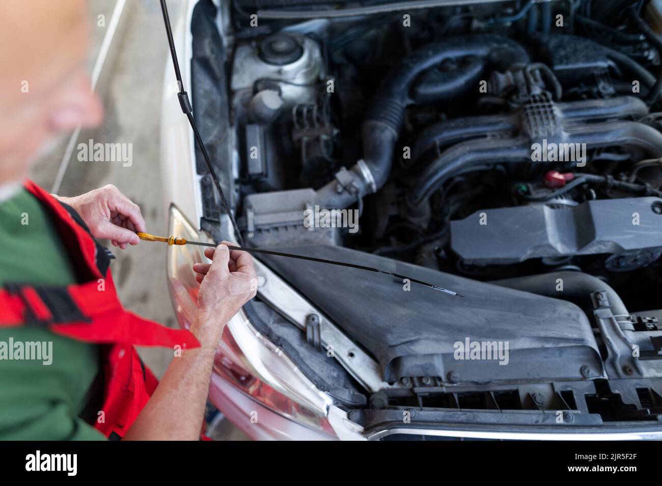 Repairman checking car engine hi-res stock photography and images - Alamy